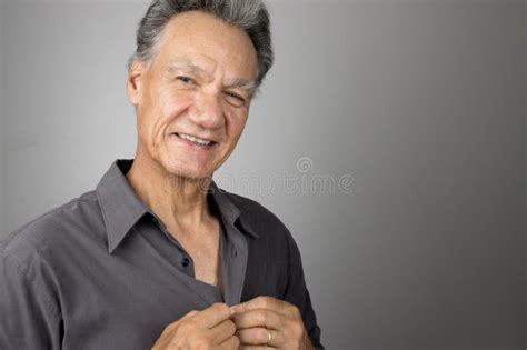 Man Buttoning Up His Shirt While Getting Dress For Work Stock Image