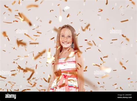 Inclusive Beauty Girl With Freckles Standing Isolated On Grey Flying