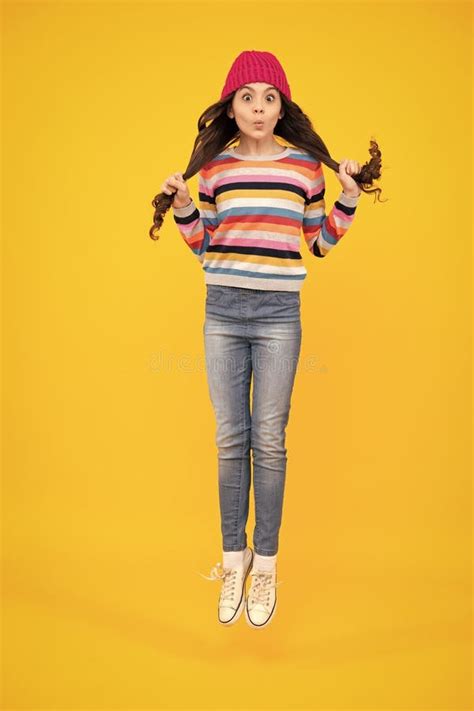 Amazed Teenager Modern Teen Girl Wearing Sweater And Knitted Hat On
