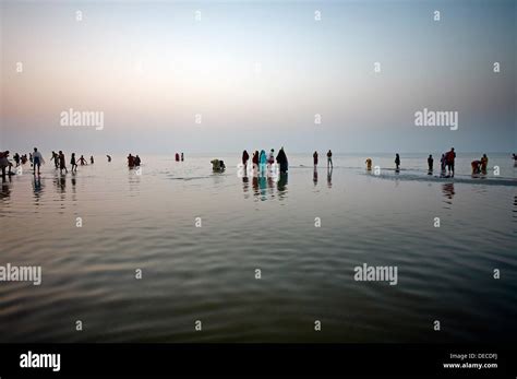 Pilgrims Bathing At The Confluence Of The River Ganges And The Bay Of
