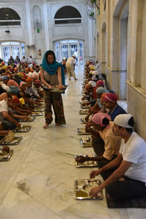 Serving At Langar In Gurudwara Where A Free Meal Is Served To All The Visitors Without