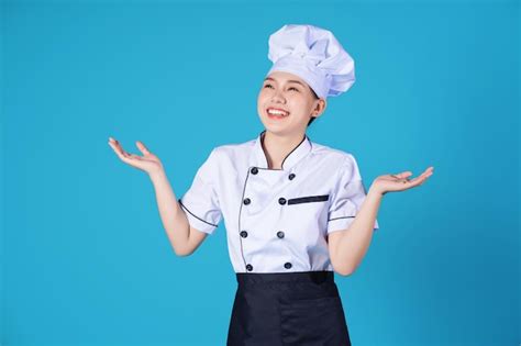Premium Photo Portrait Of Young Asian Female Chef On Background