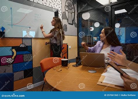 Young Employee Draws a Schedule for Colleagues on Special Board Stock Image - Image of ...