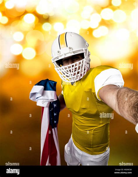Football Player With A Yellow Uniform Making A Selfie On A Yellow