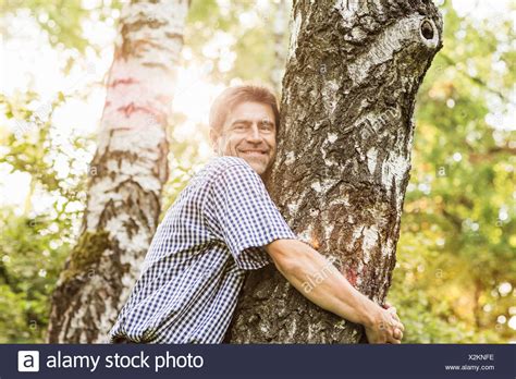 Man Hugging Tree High Resolution Stock Photography And Images Alamy
