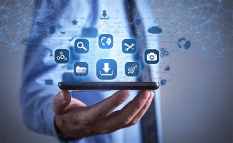 Human Using Smartphone App Icons With A Download Symbol Development Of Applications Stock