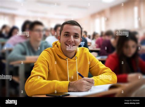 Student Taking Notes While Studying In High School Portrait Of College