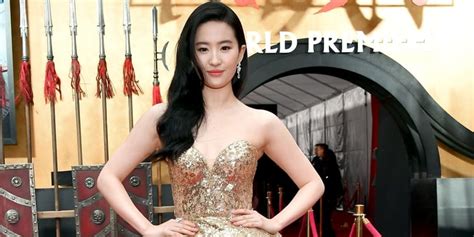 Liu Yifei Wearing Gold Elie Saab Gown At Mulan Premiere Popsugar Fashion