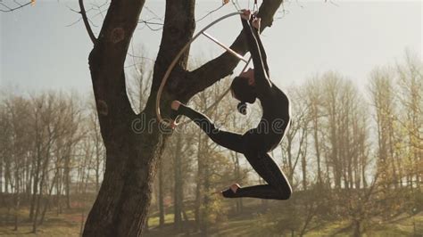 Woman Doing Some Acrobatic Elements On Aerial Hoop Outdoors Stock Video