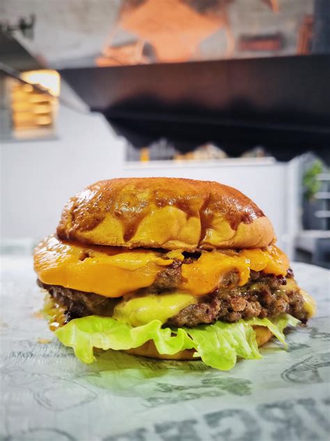 Double Smash In Brioche Bun With Lettuce And Pickled Cucumbers Dining