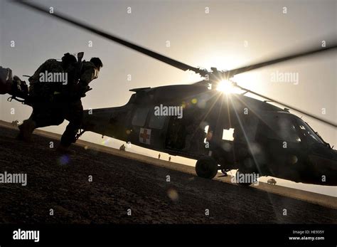 Afghan National Army Soldiers Carry An Afghan Man To A Helicopter For