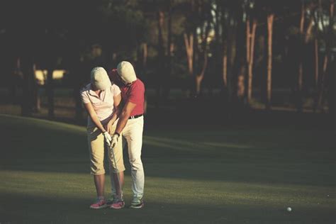 Premium Photo Male Golf Instructor Teaching Female Golf Player