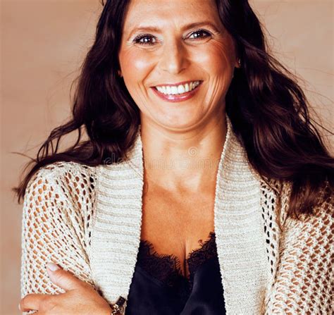 Pretty Brunette Confident Mature Woman Posing Cheerful On Warm Brown Background Lifestyle