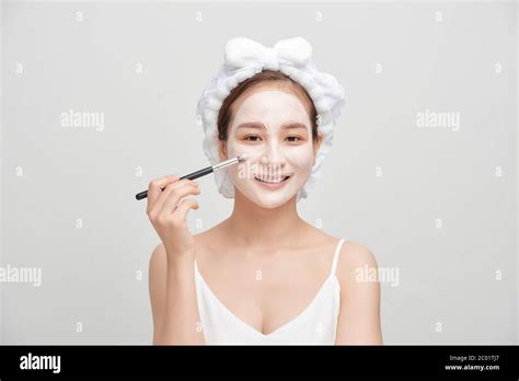 Spa Asian Woman Applying Facial Clay Mask Spa Beauty Concept Stock