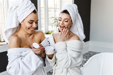 Premium Photo Cute Young Two Women Dressed In White Dressing Gowns