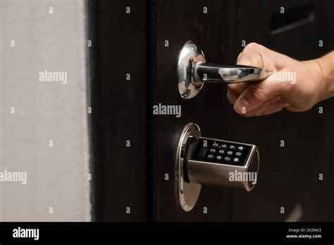 Woman Opens The Combination Lock On The Door To The Apartment Keyless Entry Stock Photo Alamy