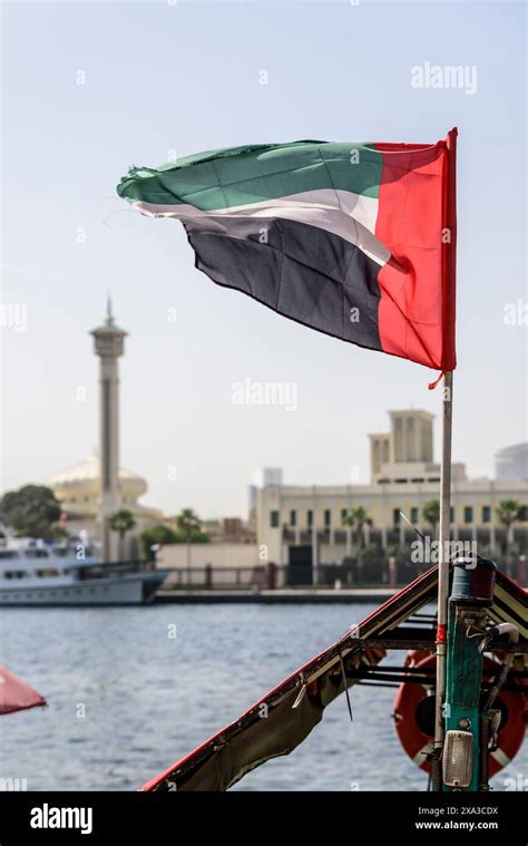 The Uae Flag Flying The Breeze On Dubai Creek With The Old District