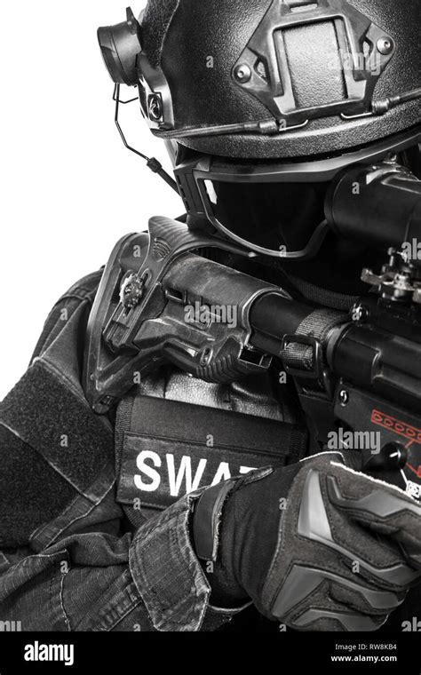 Spec Ops Police Officer SWAT In Black Uniform And Face Mask Studio