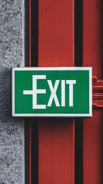 Emergency Fire Exit Sign Direction To Doorway In The Building Green