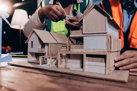 Engineers Are Helping To Design Work On Blueprints And Collaborate On