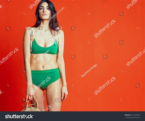 Woman Green Bathing Suit On Orange Stock Photo Shutterstock