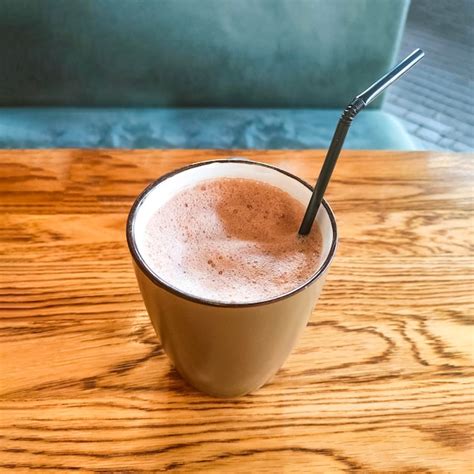 Premium Photo Cocoa Drink With A Straw In Ceramic Mug On Wooden Table