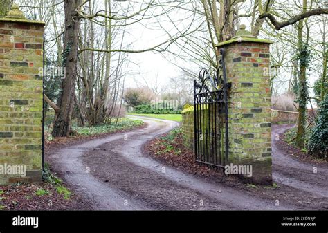 Old Open Gate Of Country Estate With Iron Antique Gate Road Leading To