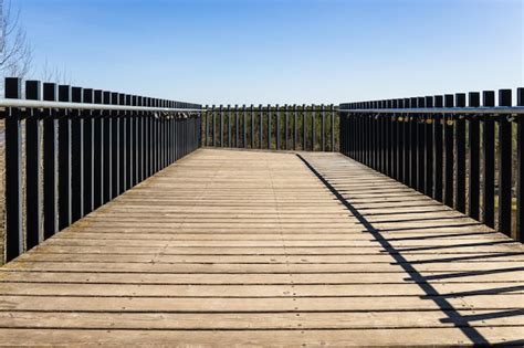 Premium Photo Wooden Platform With Steel Handrails And Love Padlocks