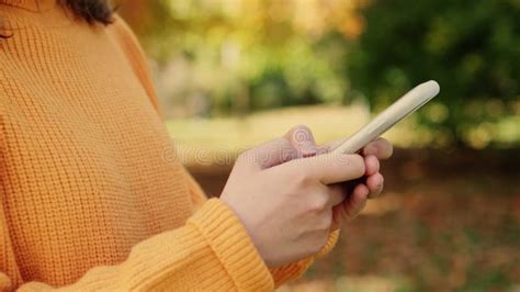 Lady Walks In Open Air While Chatting With Friend On Dating App Stock