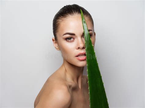 Portrait Of Woman With Bare Shoulders Green Aloe Leaf Cosmetology