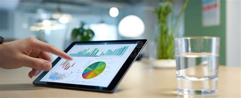 The Tablet Displaying Interactive Charts And Graphs In A Modern Business Environment Ai