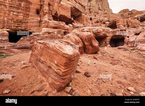 Simple Dwelling Ruins Cave Like Holes In Stone Wall Cloudy Sky Above