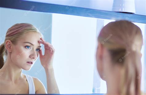 Premium Photo Face Of Young Beautiful Healthy Woman And Reflection In