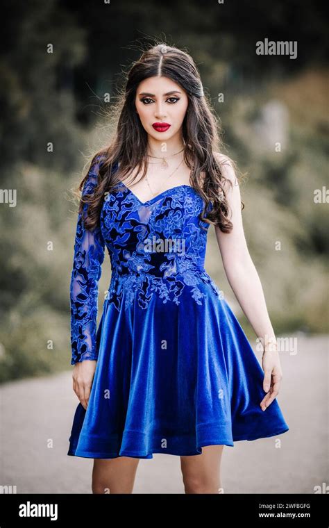 Beautiful Elegant Woman Wearing Blue Evening Dress Looking At Camera