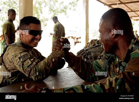Soldiers From 36th Engineer Brigade And Ghana Armed Forces Arm Wrestle