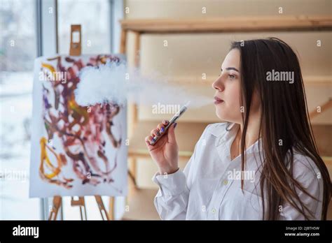 Modern Girl Smoking Vapetrendy New Vaping Devicesmoke E Liquid