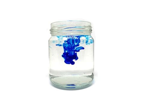 Premium Photo Blue Liquid Dissolving In Water Over White Background