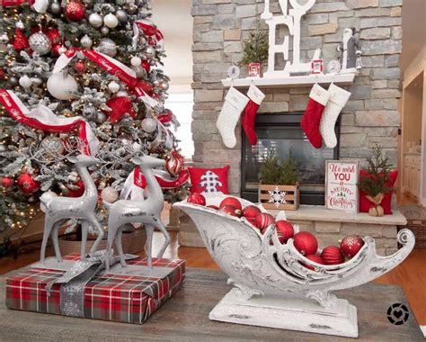 Large Red White And Silver Decorated Christmas Tree Next To Stone