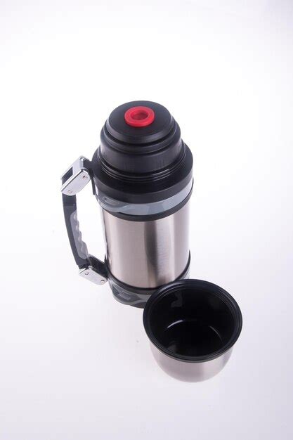 Premium Photo High Angle View Of Insulated Drink Container Against