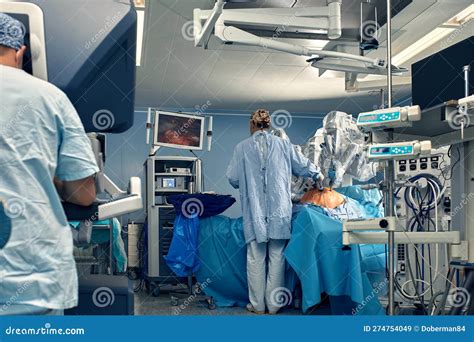 Carrying Out An Operation Using A Robot A Robot Surgeon With