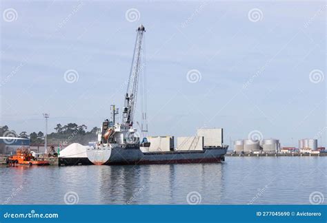Screne Of A Cargo Ship Loading Gravel At The Port Of Vilagarcia De