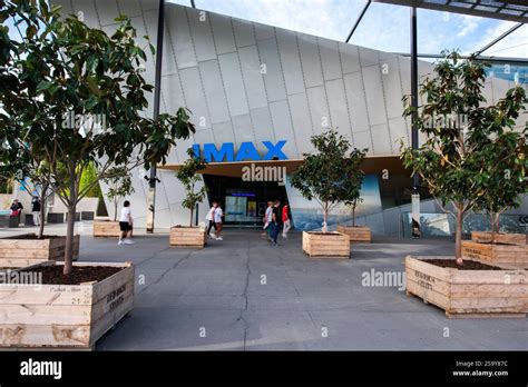 Visitors Walking Under Sloping Roof Striking Architecture And Stark