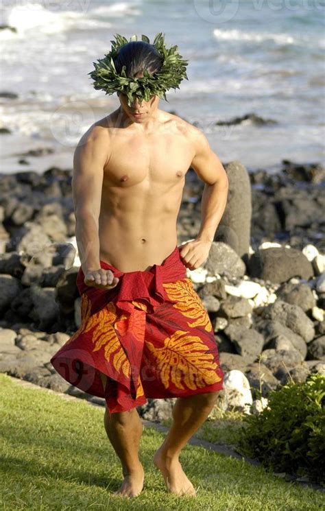 Male Hula Dancer Performs At The Shoreline With Manly Moves And