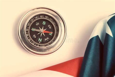 Compass Pointing West And Star Spangled Flag United States America