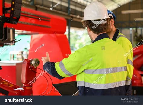 Two Technicians Workers Safety Uniform Talking Stock Photo 2234476779