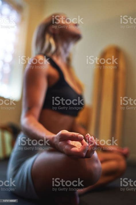 Hand View Of Caucasian Woman Sitting In Lotus Position With Closed Eyes Meditating Indoors Stock