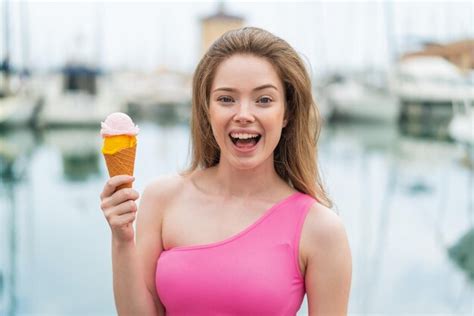 Premium Photo Young Redhead Woman With A Cornet Ice Cream At Outdoors
