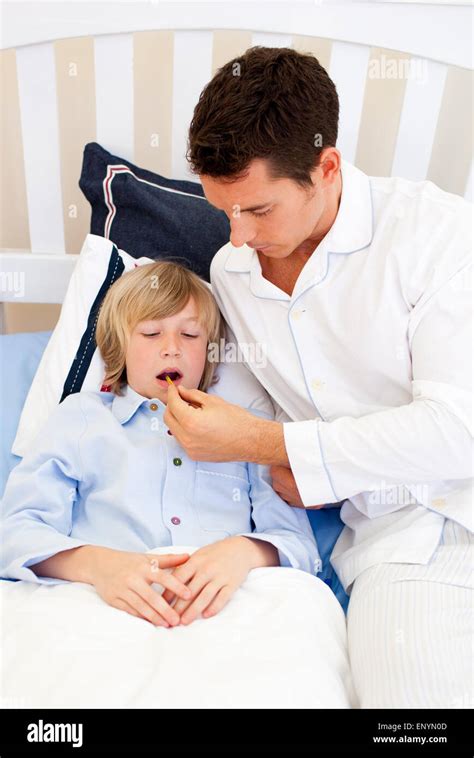 Attentive Father Checking His Son S Temperature Stock Photo Alamy
