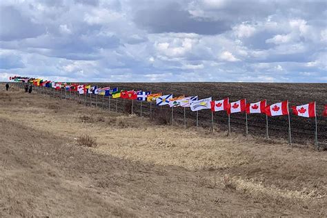 Raising Flags Along Hwy 11 Near Red Deer To Honour First Responders