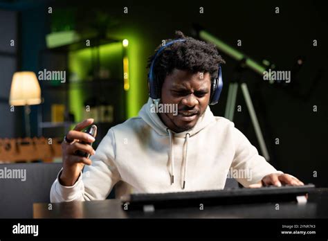 African American Player Shouting After Failing To Win Videogame While